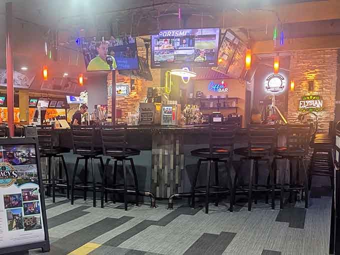 The bar area features stone accents and plenty of screens for catching the game between frames.