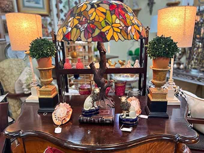 A stained glass lamp, ceramic dogs, and matching topiaries walk into a bar. The result is this gorgeous display.