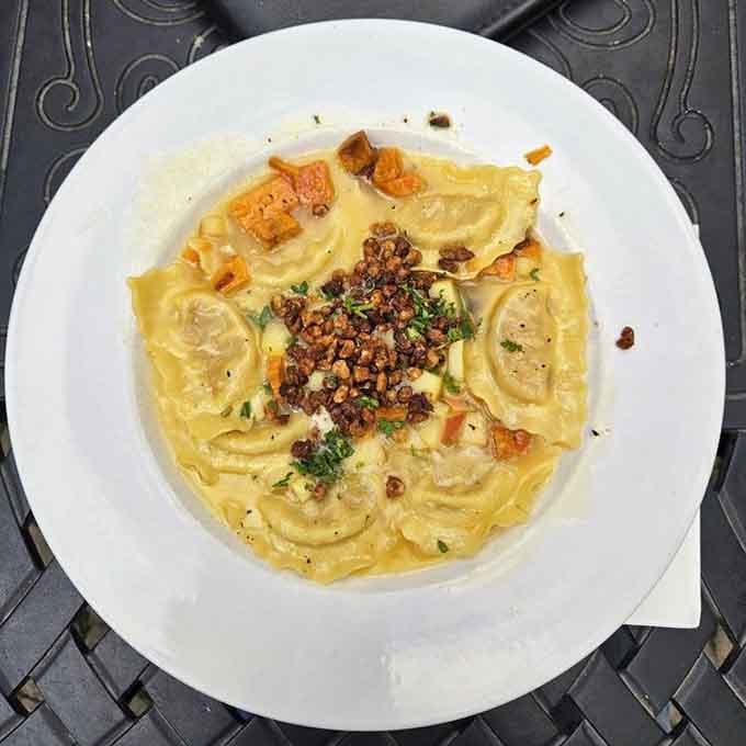 Pillowy ravioli swimming in a buttery sauce with toasted walnuts, this is comfort food with a diploma.