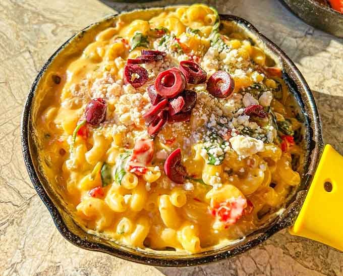 Mediterranean mac loaded with feta and kalamata olives transports your taste buds straight to the Greek islands, minus the airfare.