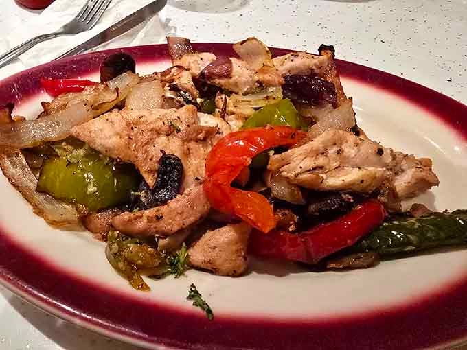 Mama Santa's Chicken Pizzaiola, colorful peppers and tender chicken together, is comfort food wearing its Sunday best.