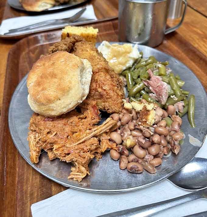 This loaded plate proves the Founding Fathers knew how to eat: biscuits, chicken, and enough sides to fuel a revolution.