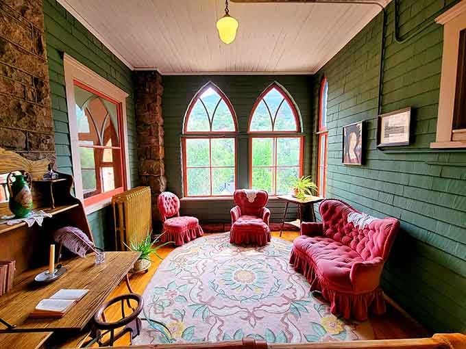 Gothic arched windows, tufted red velvet, and mountain views that would make any Victorian swoon with delight.