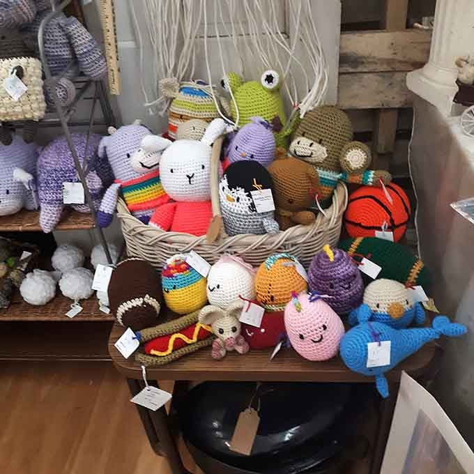 A basket full of handmade crochet characters so charming, you'll feel guilty leaving even one of them behind.
