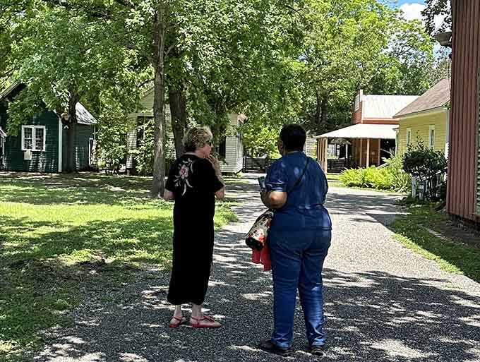 Two visitors pause mid-path, probably realizing this place deserves more than a quick afternoon stroll.
