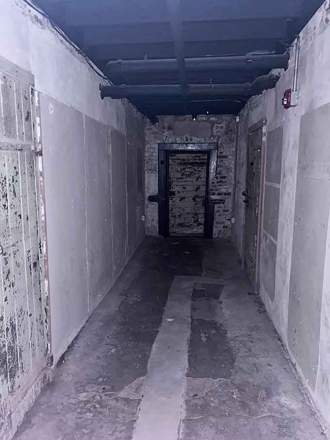 This hallway doesn't lead anywhere cheerful. Every crack in the wall has a story.