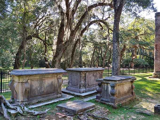 Three raised stone tombs clustered beneath the oaks &mdash; this is what centuries of lowcountry history looks like up close.