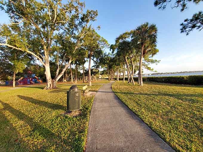 R.E. Olds Park's walking path winds through palms and oaks, leading straight to those Tampa Bay views.