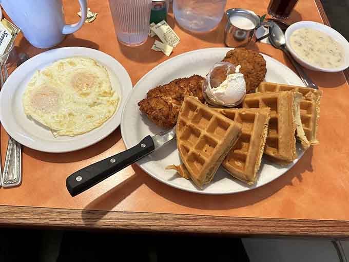 Chicken and waffles together at last, the culinary odd couple that somehow makes perfect sense on your plate.