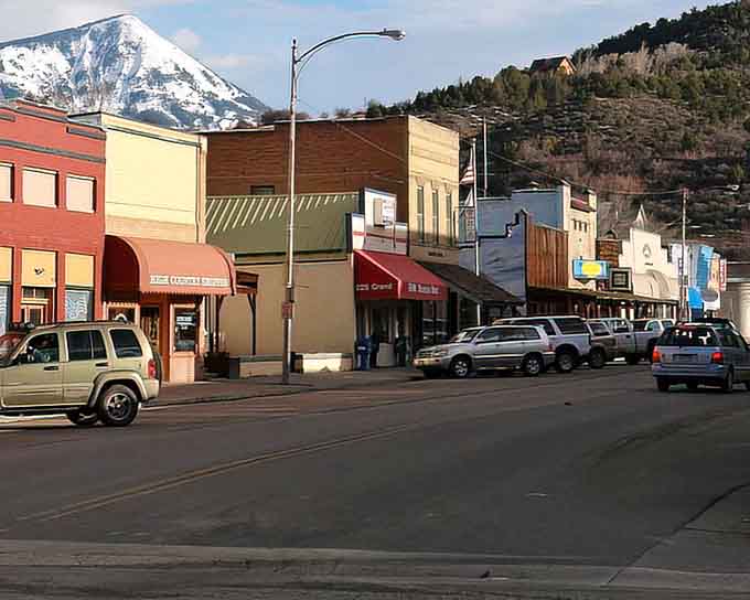 Winter doesn't dim Grand Avenue one bit, with snow-capped peaks standing guard over this quietly confident little main street.