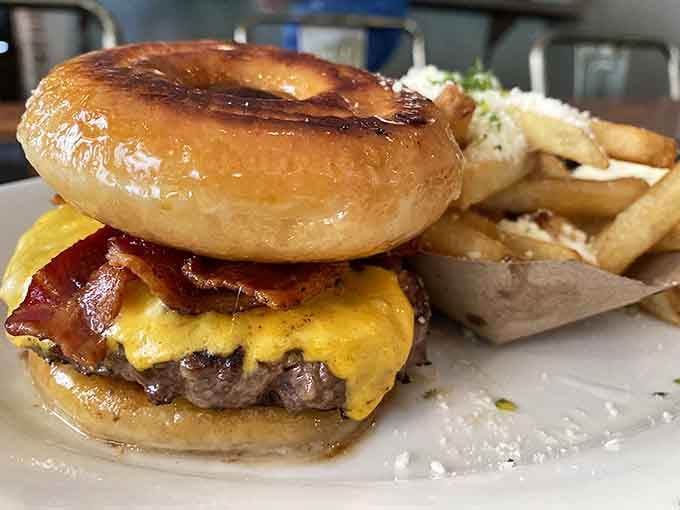 A glazed donut bun holding bacon, egg, and cheese together, proof that someone at Parma Tavern is a genius.
