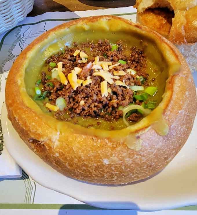 When a sourdough loaf becomes the bowl, topped with bacon bits, scallions, and cheddar, lunch just became an event.