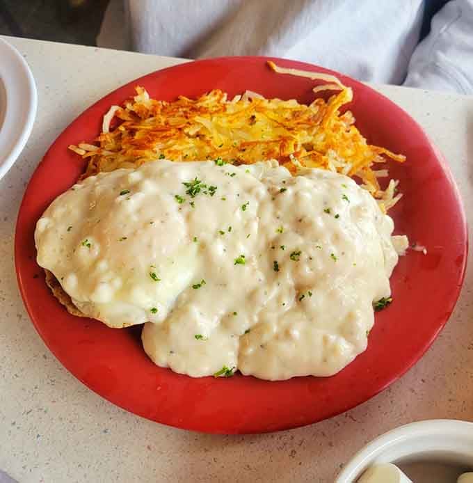 Biscuits drowning in sausage gravy, the kind of breakfast that makes you understand why mornings were invented.