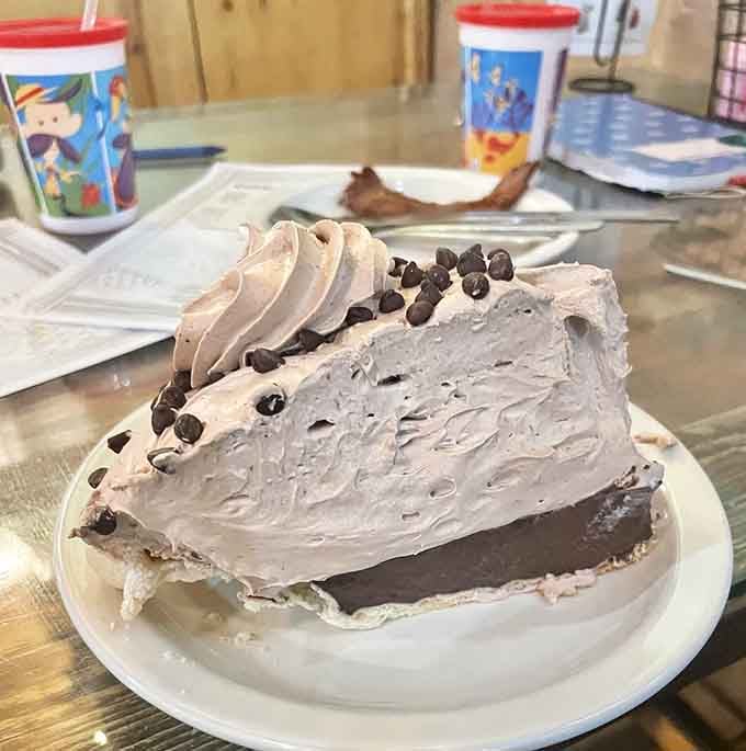 A slice of chocolate cream pie so tall it needs its own zip code. Resistance is futile.