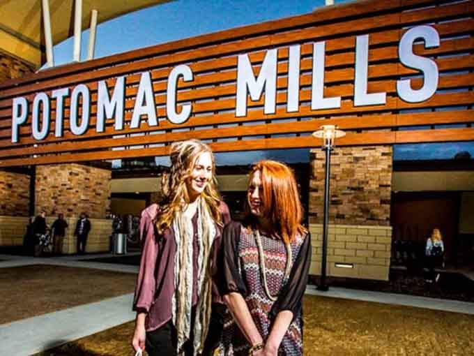 Two friends ready to conquer outlet prices like it's an Olympic sport they've been training for.