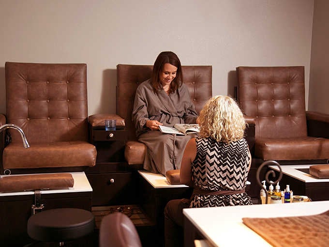 Pedicure stations where conversations flow as smoothly as the polish, and nobody judges your winter feet.