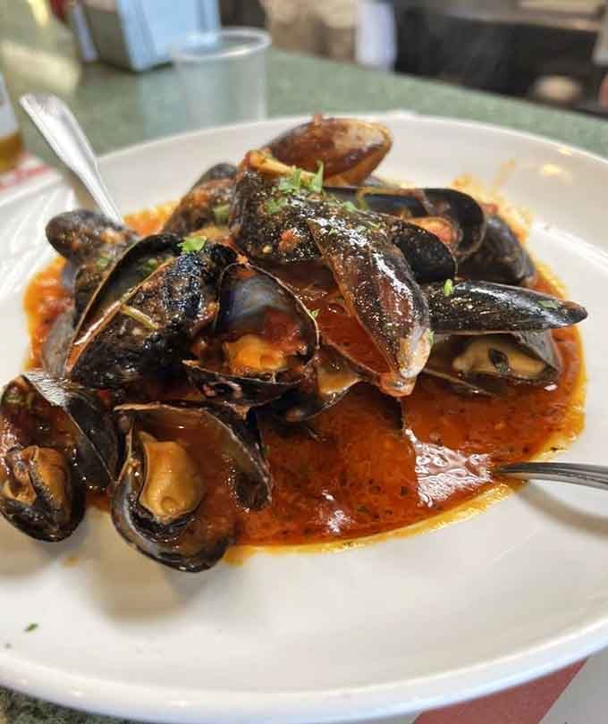 Plump mussels swimming in a bold, glistening red sauce, this is Italian-American cooking that means every word it says.