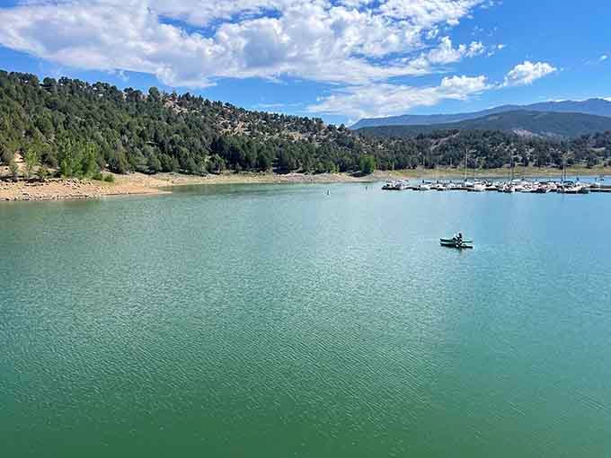One lone kayaker on Ridgway Reservoir, living the dream the rest of us are still planning for.