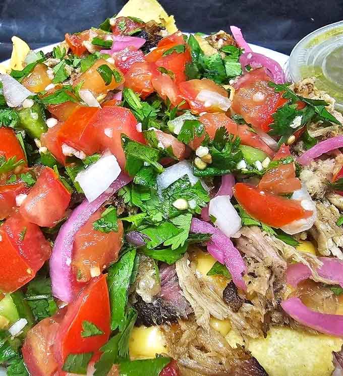Brisket nachos piled so high they require both hands and zero apologies. Texas does nothing halfway.