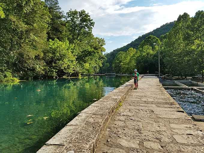 A quiet stone walkway beside a river so scenic it puts other fishing spots to shame.