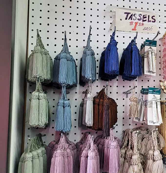 A pegboard full of decorative tassels in every shade imaginable, proof that the details really do make the difference.