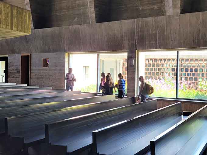 Nothing says "contemplative space" quite like concrete benches bathed in natural light, where even tourists instinctively start whispering and reflecting.