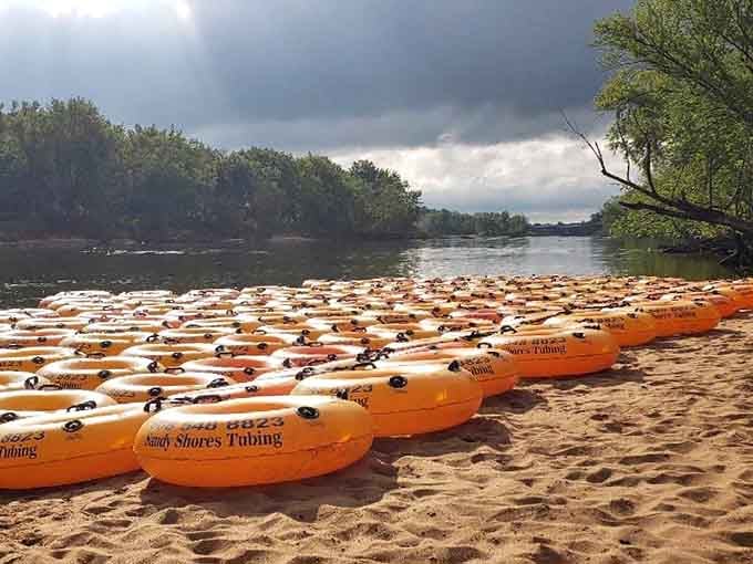 Rows of bright orange tubes waiting for their moment. This is what a perfect summer day looks like before it starts.