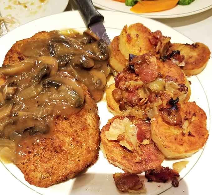 Golden, crispy schnitzel beside perfectly pan-fried potatoes. This plate is not here to play games.