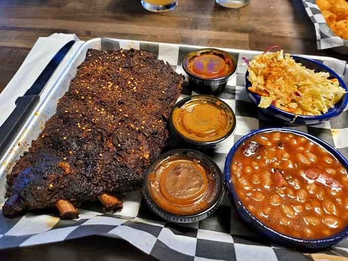 A full rack of ribs with three dipping sauces is not a meal, it's a commitment.