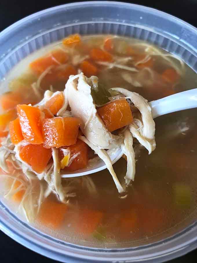 Tender chicken, bright carrots, and golden broth on a single spoon. That's not lunch, that's a warm hug with excellent timing.