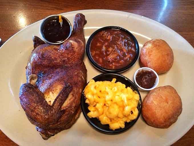 A whole smoked half chicken with barbeque beans and mac and cheese. This plate means business.