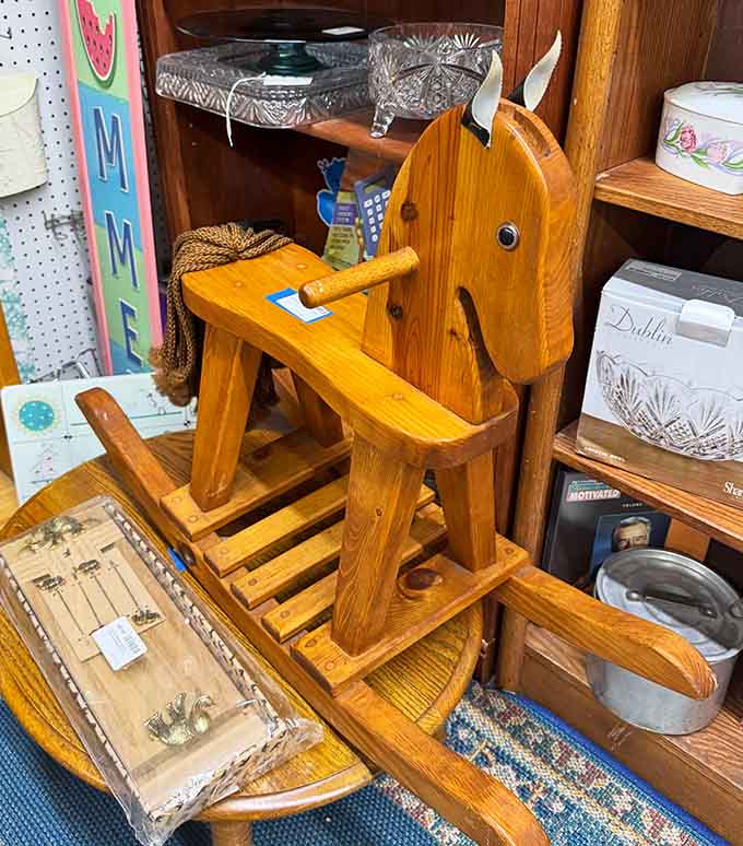 This solid wooden rocking horse has clearly survived decades of childhood adventures and still looks ready for more.
