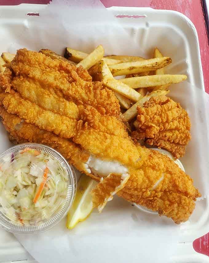 Perfectly fried haddock with golden fries and creamy coleslaw, this plate is southeastern Massachusetts on a tray.