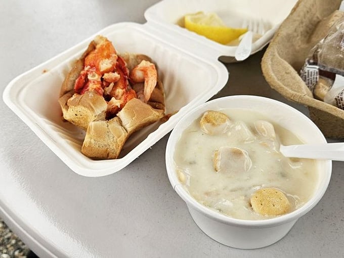 A lobster roll and a bowl of chowder sitting side by side is basically the Connecticut coast on a table.