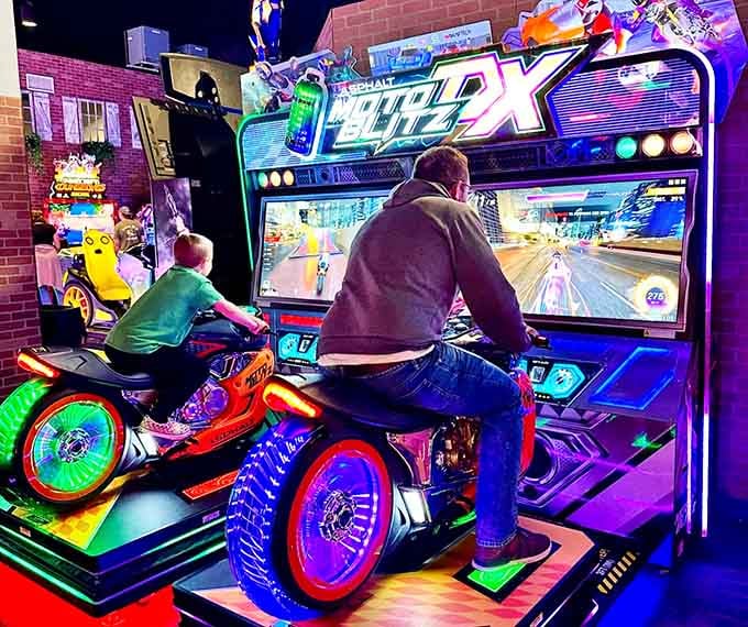 Father and child, side by side on motorcycle simulators &mdash; this is the kind of bonding no therapist could prescribe.