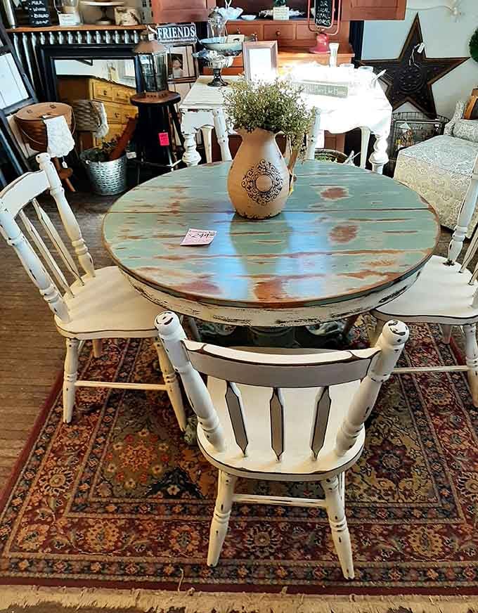 That distressed turquoise dining table is the kind of piece your living room has been quietly waiting for.