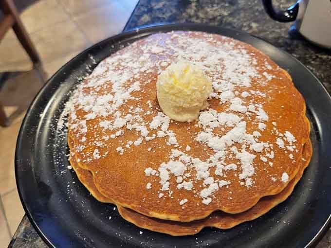 Golden, fluffy, dusted with powdered sugar, and crowned with butter. These pancakes mean absolute business.