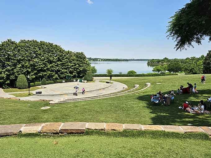 Families spreading out on the grass near the lake, because some afternoons are simply too good to rush.