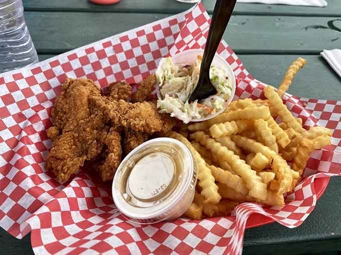 Golden, crispy chicken tenders with crinkle fries and coleslaw, because some meals just get everything right.