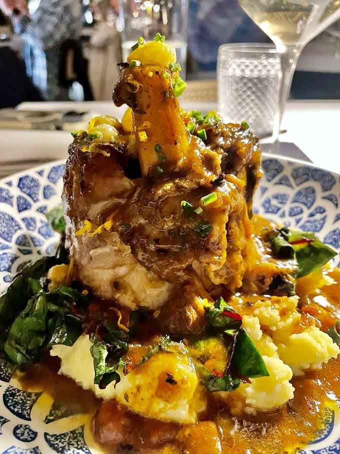 That pork shank is braised, sauced, and sitting on polenta like it has absolutely nowhere else to be.