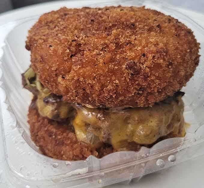 When a burger meets mac and cheese between crispy buns, you get the kind of fusion that makes perfect sense.