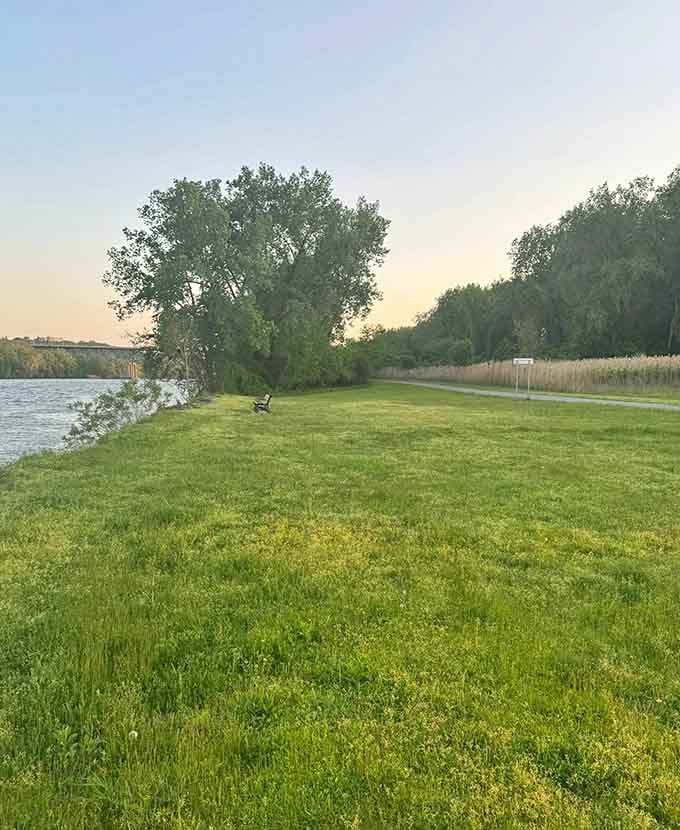 A lone Adirondack chair perched at the water's edge is basically nature's way of saying, "Sit down and stay awhile."