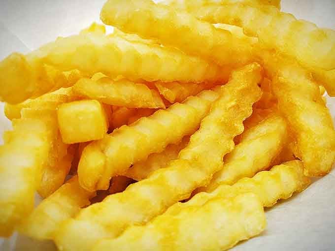 Crinkle-cut fries so perfectly golden they could make a grown adult weep with joy. Simple, honest, glorious.