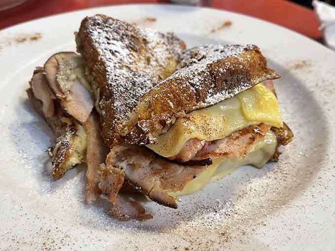 Dusted with powdered sugar and stacked with ham and melted cheese, this Monte Cristo is breakfast and lunch shaking hands warmly.