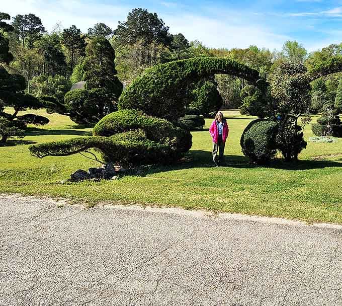 Standing next to a towering arched topiary puts things in perspective, namely that nature, with a little guidance, is absolutely enormous.