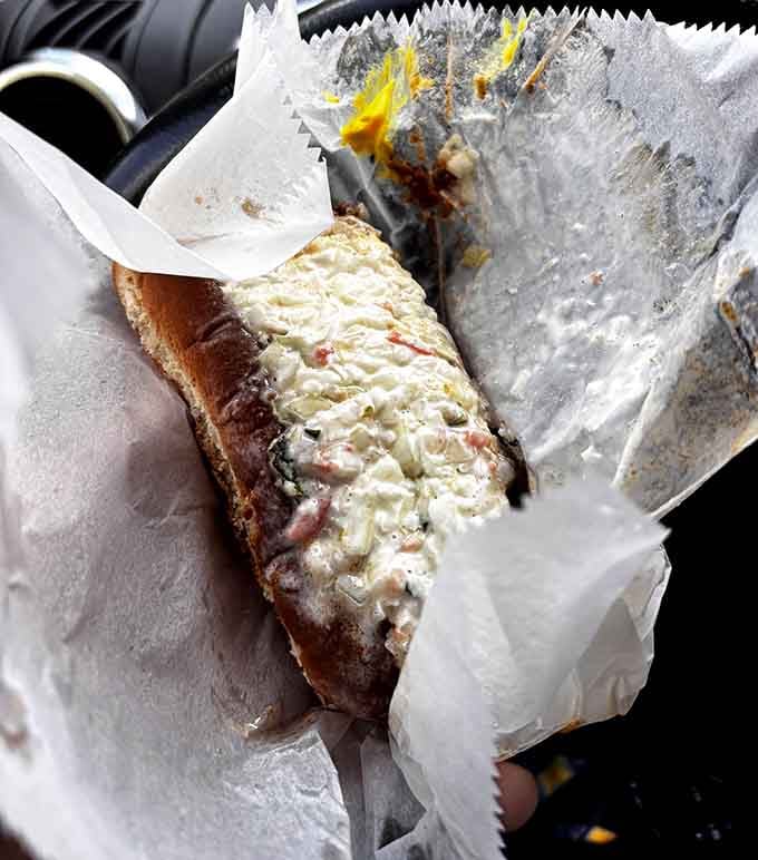 That creamy coleslaw on top isn't decoration, it's the genius move that changes everything about this dog.