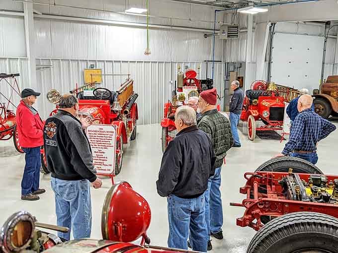 Enthusiasts gather around vintage machinery, sharing stories and admiration for these mechanical marvels from yesteryear.