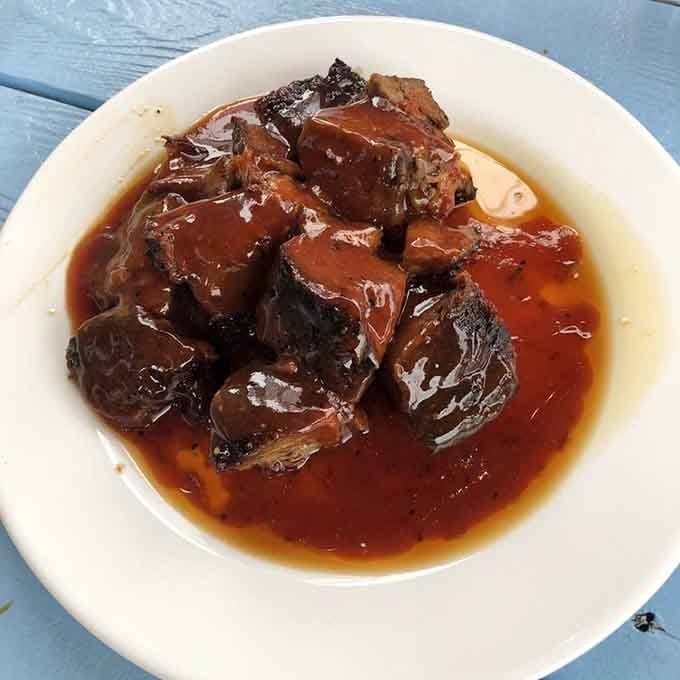 Kansas City Burnt Ends swimming in house-made sauce. Tender, smoky, and deeply serious about making you forget your troubles.