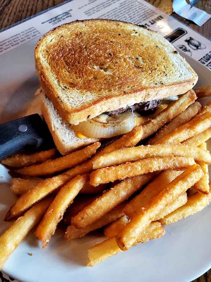 The patty melt achieves sandwich perfection: golden toast, caramelized onions, melted cheese, and fries that deserve their own standing ovation.