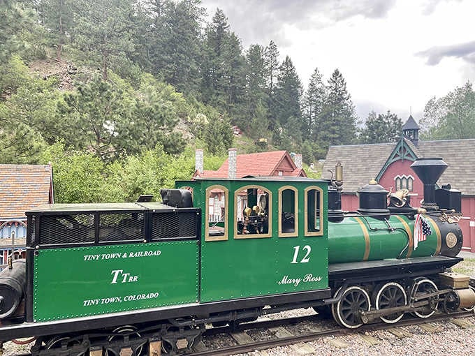 Meet Mary Ross, locomotive number 12, the emerald green heartbeat of Tiny Town Railroad, ready to roll through the Rockies.